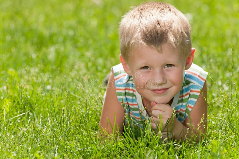 246 Boy Alone Lying Green Grass Stock Photos - Free & Royalty-Free ...