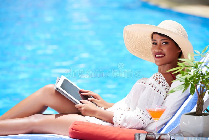 Resting by pool stock photo. Image of summer, application - 79141068