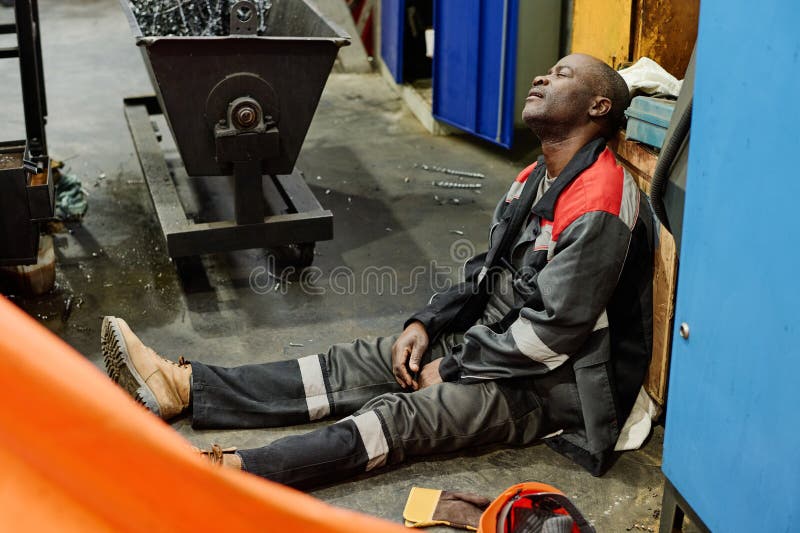 Resting Worker Sitting in Industrial Workspace Stock Image - Image of ...
