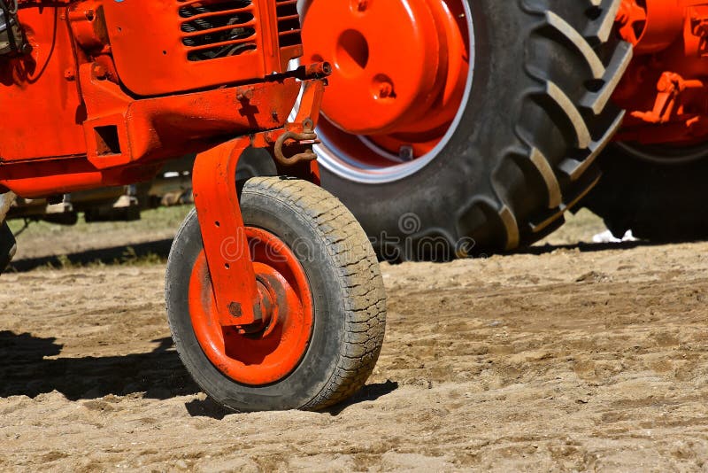 One Wheeled Old Orange Tractor Stock Photo - Image of agriculture ...