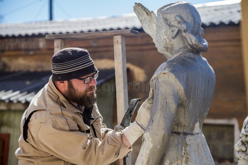 Restorer is Engaged in the Restoration of the Statue Stock Image ...