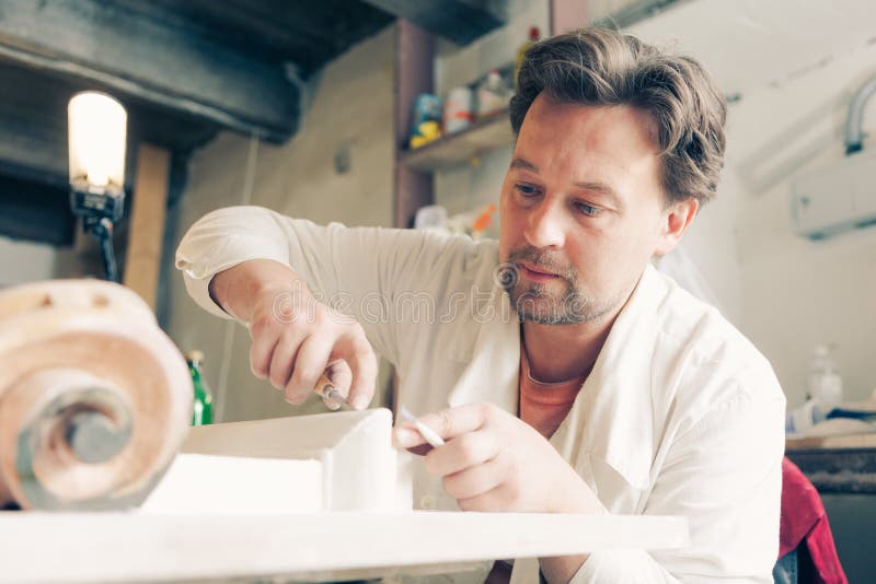 Restorer making his work stock photo. Image of renovate - 56565330