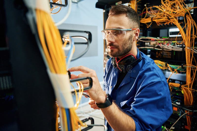 Restoring the Internet Connection. Young Man is Working with Equipment ...