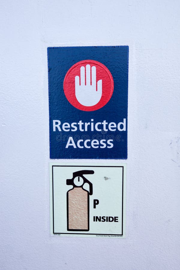 Restricted Access Warning Sign in Yellow Letters Painted Over Dark ...