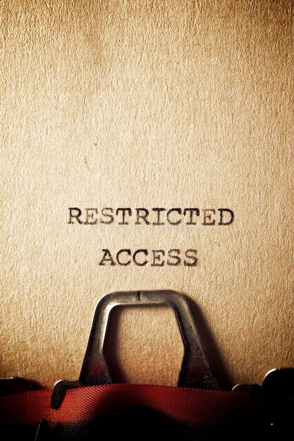 Restricted Access Warning Sign in Yellow Letters Painted Over Dark ...