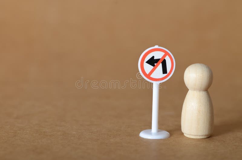 Restricted Path: a Lone Wooden Figure and No Left Turn Sign Stock ...