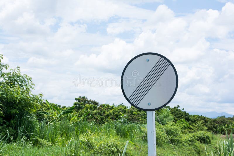 Restriction Ends Sign beside the Road with Tree and Sky Background ...