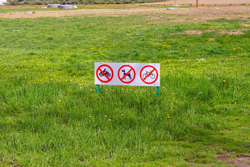 Restrictions signs grass stock image. Image of warning - 230571611