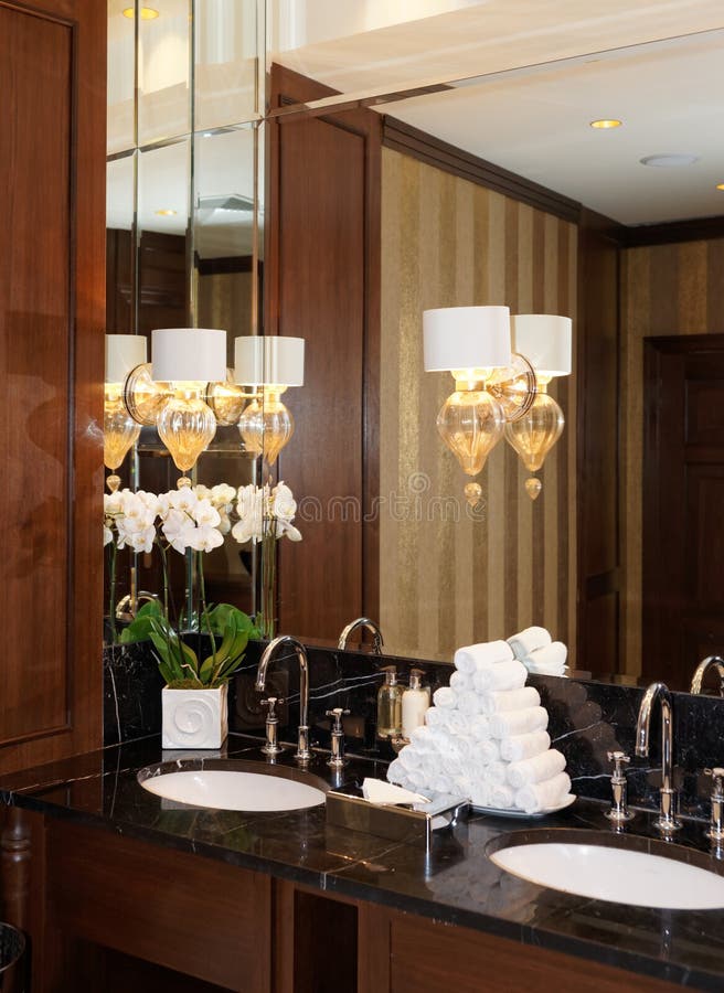 Restroom in Hotel or Restaurant Stock Photo - Image of mirror, golden ...