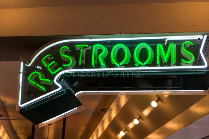 Green Sign Pointing Way To Washrooms Stock Image - Image of bathroom ...