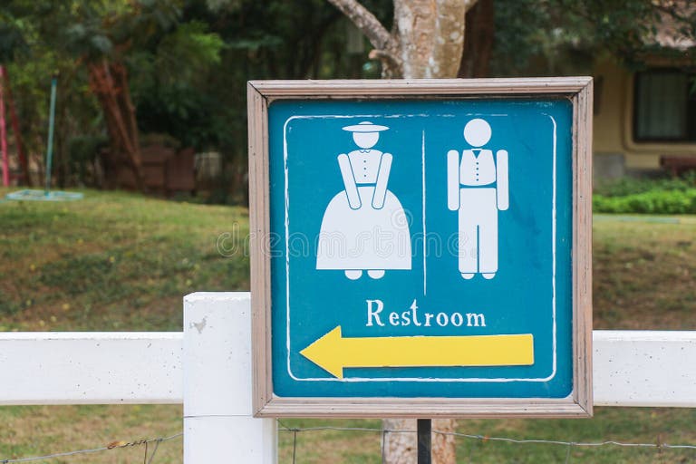 Restroom Sign with Pointing Arrow Stock Photo - Image of international ...