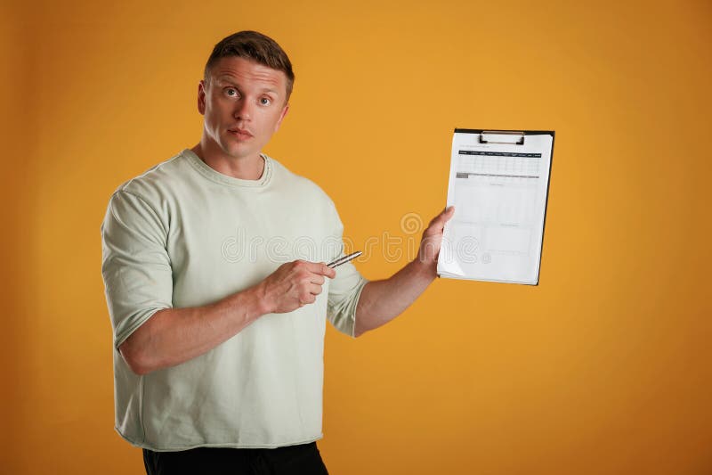 Results, Data in the Notepad, Holding it. Man is Against Background in ...