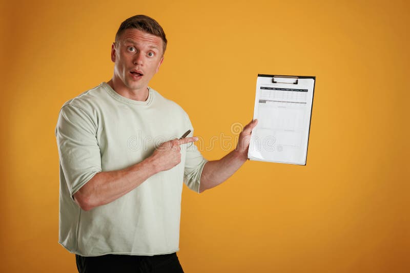 Results, Data in the Notepad, Holding it. Man is Against Background in ...