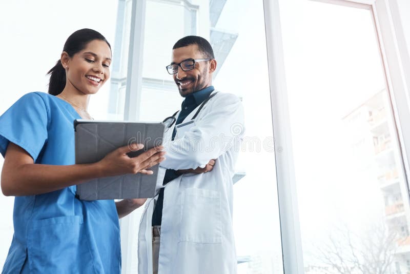 These are the Results from the Lab. Two Young Doctors Using a Digital ...