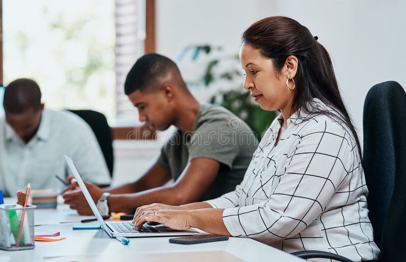 Results is What Shes after. a Young Businesswoman Using a Computer in a ...