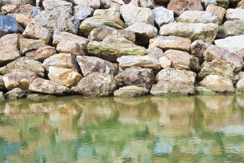 Retaining Breakwater Wall Built with Stone Boulders Stock Image - Image ...
