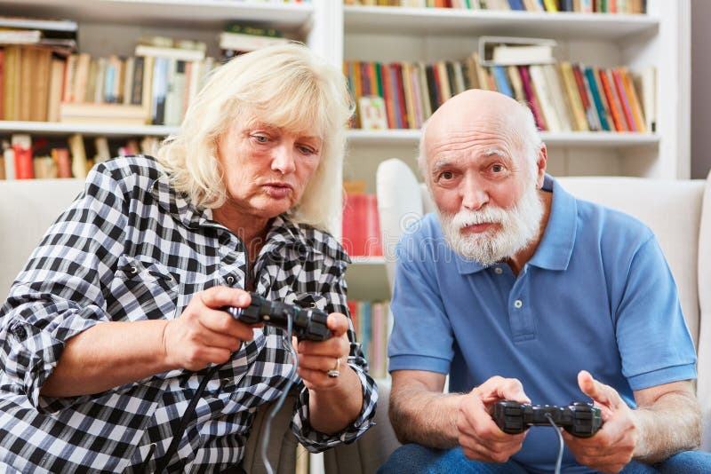 Retired Couple Plays Video Game Stock Photo - Image of citizens, people ...