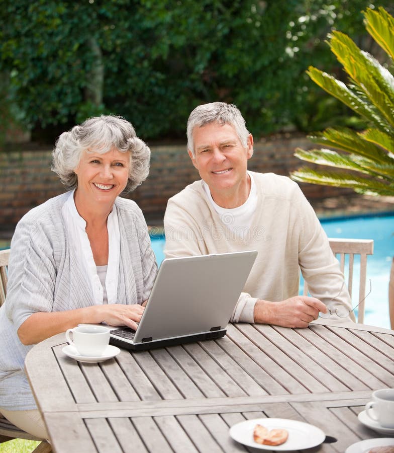 Retired Couple Working on Their Laptop Stock Image - Image of business ...