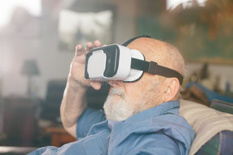 Old Man Using Virtual Reality Goggles at Home Stock Photo - Image of ...