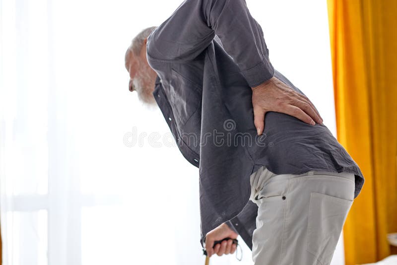 Retired Man Suffering from Back Pain at Home, Having Difficulty in ...