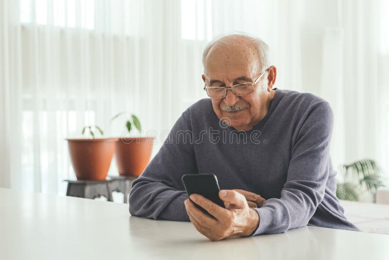 Retired Man Using Computer Technologies at Home Stock Photo - Image of ...