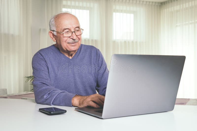 Retired Man Using Computer Technologies at Home Stock Image - Image of ...