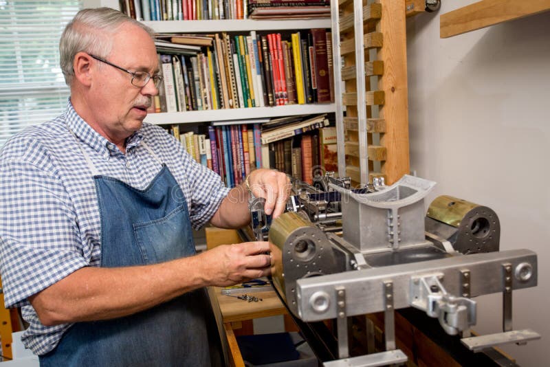 Retired man in workshop stock photo. Image of restores - 56180002