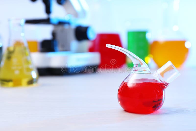 Glass Retort Flask with Red Liquid Sample Isolated. Laboratory Analysis ...