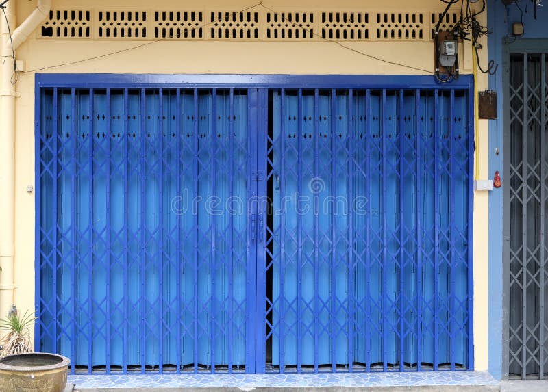 Retractable Folding Metallic Grill in Front of a Shop Stock Photo ...