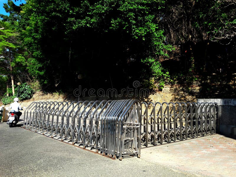 Retractable Stainless Steel Barrier Fence with Casters Installed As a ...
