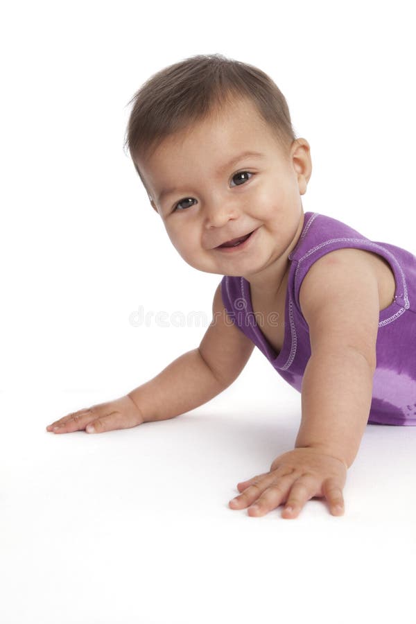 Bebé Orgulloso Que Se Coloca Con Una Cierta Ayuda Foto de archivo ...