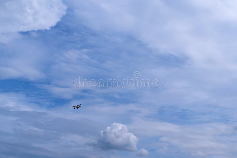 Retro Airplanes Fly a Triangle Under White Clouds in the Blue Sky Stock ...