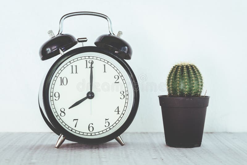 Retro Alarm Clock with Cactus on Table Stock Photo - Image of table ...