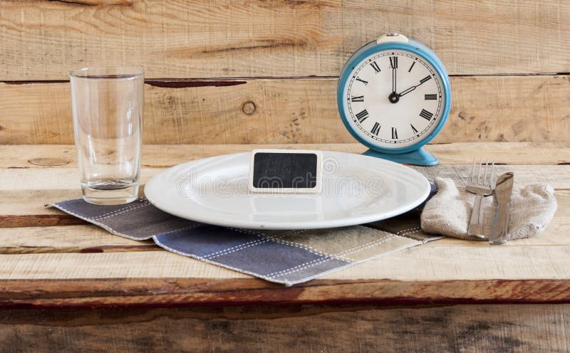 Retro Alarm Clock on a Plate Stock Photo - Image of plate, chalkboard ...