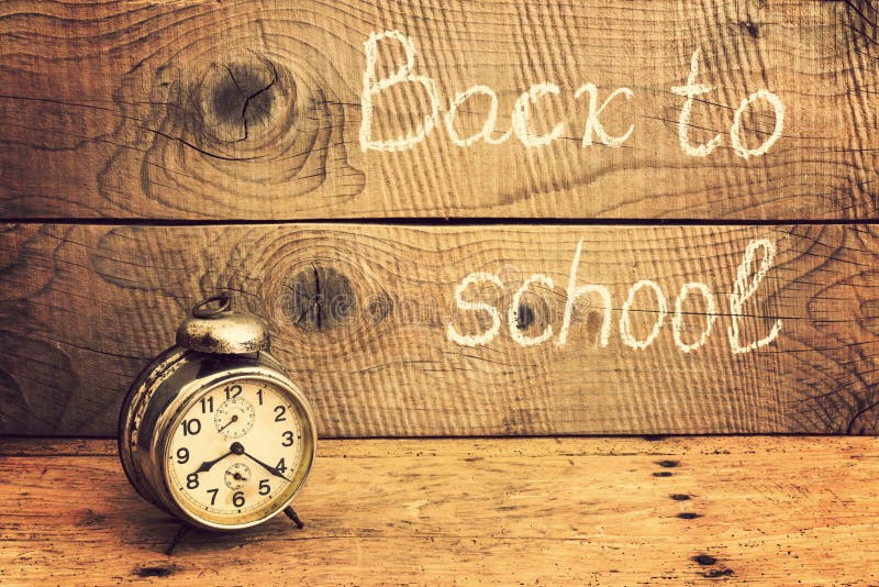 Retro Alarm Clock on a Rustic Table and Back To School Inscription ...
