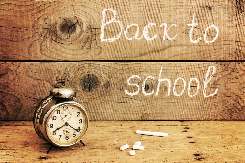 Retro Alarm Clock on a Rustic Table and Back To School Inscription ...