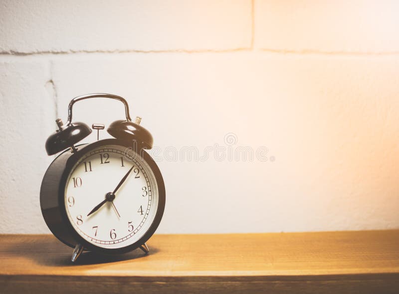 Retro alarm clock on table stock photo. Image of analog - 73771004