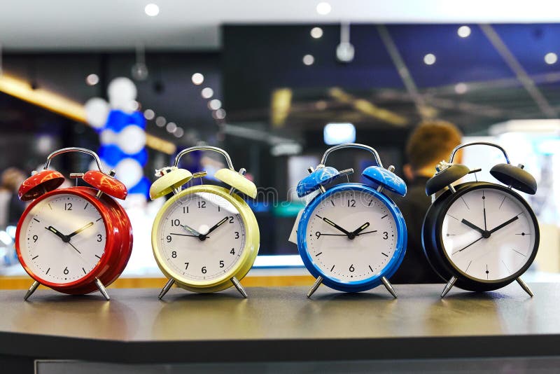 Retro Alarm Clock on the Table in a Row Stock Image - Image of hand ...