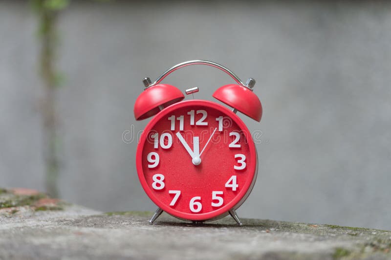 Retro Alarm Clock with Five Minutes To Twelve O`clock. Stock Image ... Retro Alarm Clock with Five Minutes To Twelve O`clock. Stock Image ...