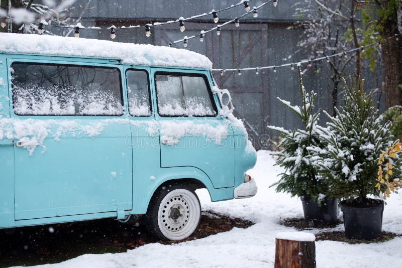 Retro Blue Van Covered in Snow, Parked Near Pine Trees and String ...