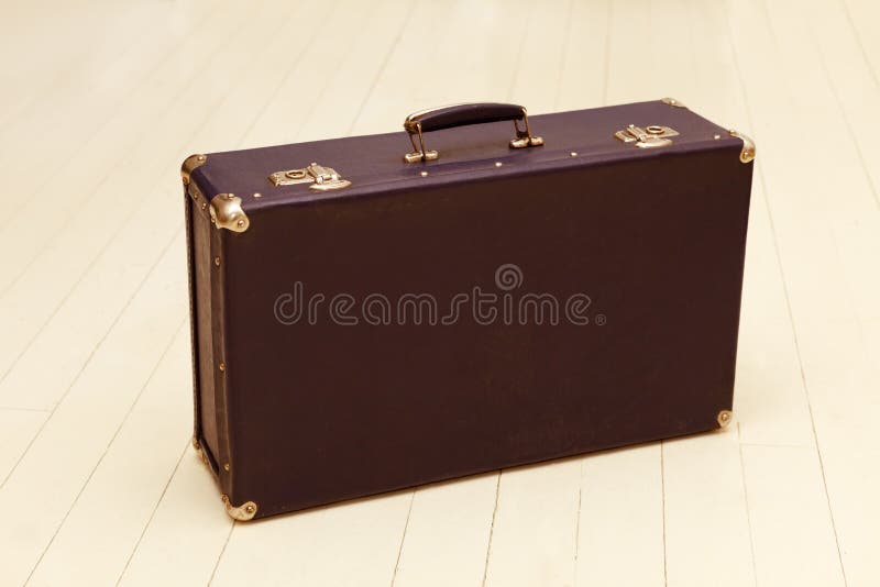 Retro Brown Suitcase with Metal Corners on White Floor Stock Photo ...