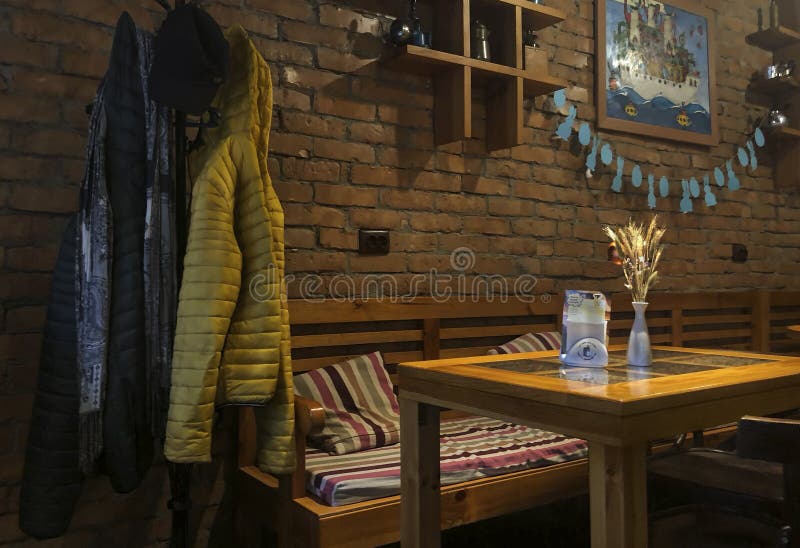 Retro Cafe Interior Interior with Hanger and Table and Brick Wall ...