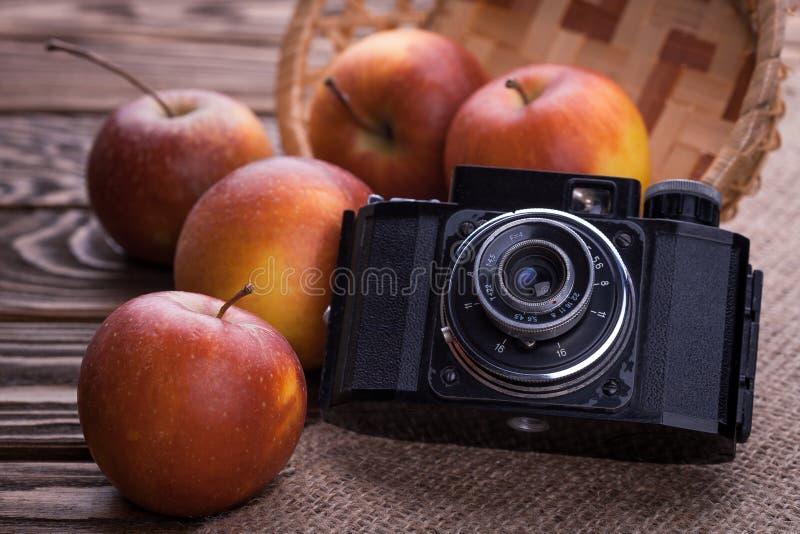 Retro Camera and Red Apples on Wooden Table Stock Image - Image of ...