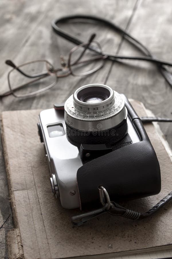 Retro camera on the table stock image. Image of table - 47745095