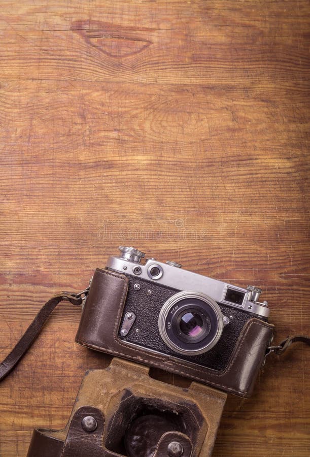 Retro camera on wood table stock photo. Image of closeup - 56620338