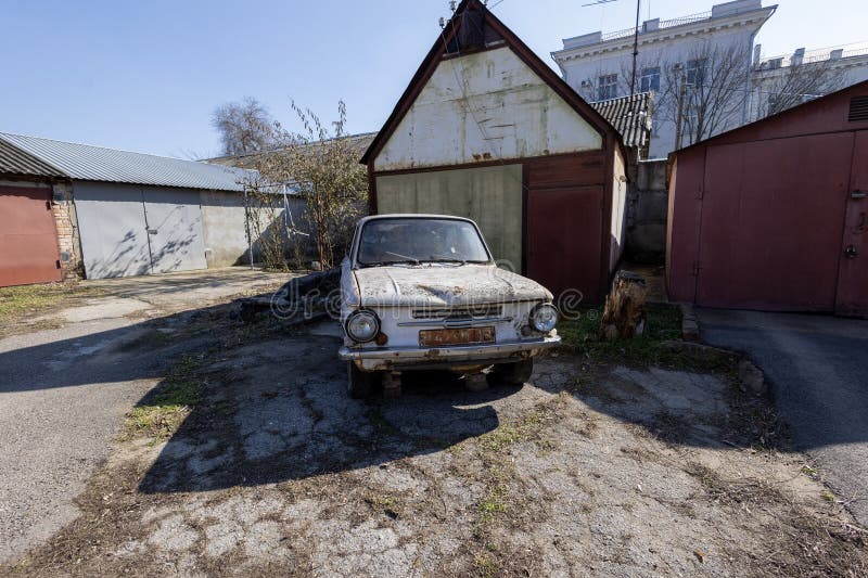 Retro Car Covered in Rust with Round Lights in an Old Garage Editorial ...