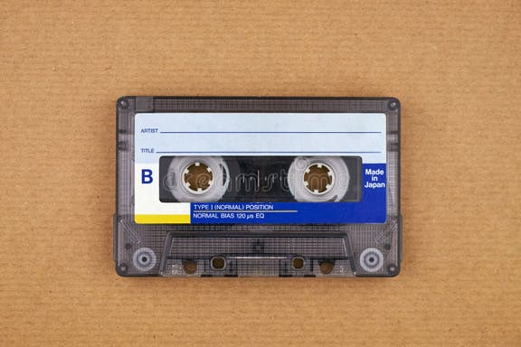 Retro Cassette Tape on a Textured Paper Surface Stock Image - Image of ...