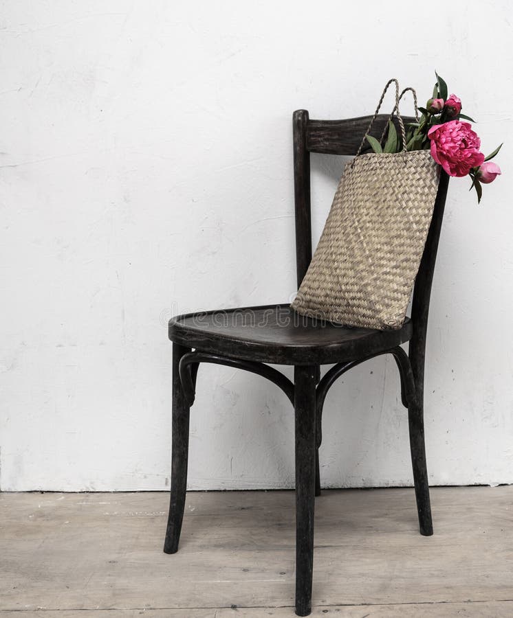 Retro Chair in Empty Room with Straw Bag and Flowers Stock Photo ...