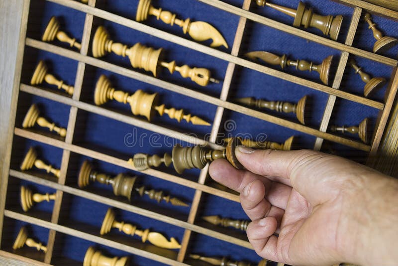 Hand and Chess Set stock image. Image of closeup, angled - 120219225