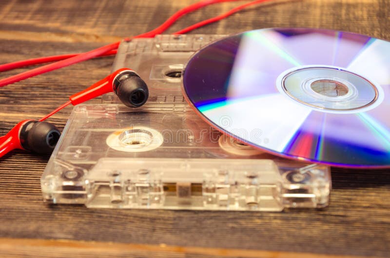Retro Compact Cassette with Disc and Headphones on Wood. Stock Photo ...